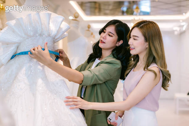 Female bridal store owner work in wedding studio shop. Owner Of Bridal ...
