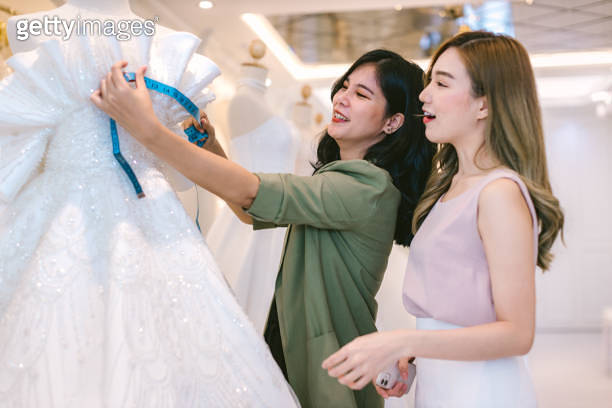Female bridal store owner work in wedding studio shop. Owner Of Bridal ...