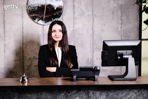 Portrait of receptionist at desk in lobby. Banner design. Friendly ...