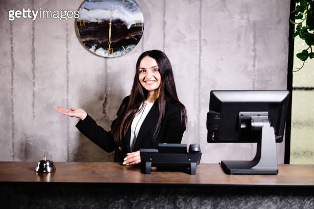 Portrait of receptionist at desk in lobby. Banner design. Friendly ...