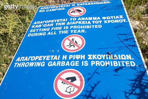 Warning Sign on Dionyssos Beach at Rethymno Province in Crete, Greece ...