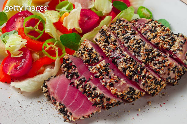 fillet of red tuna meat, fried in sesame seeds, homemade, close-up, no ...