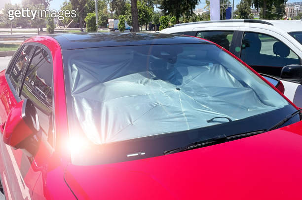 Protective reflective surface under the windshield of the passenger red ...