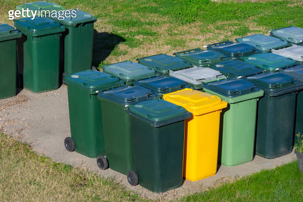 A lot of plastic bins for street waste collection points are made up ...