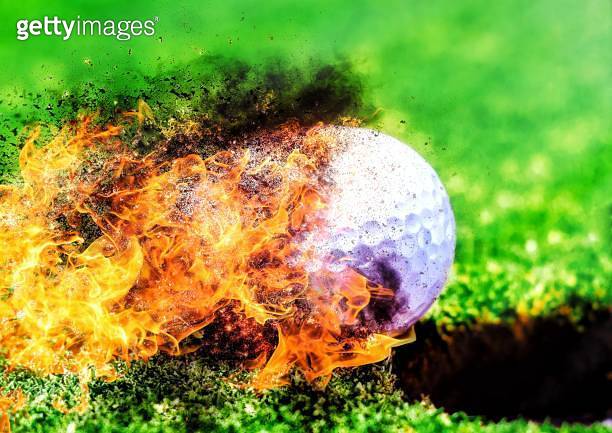 Composite background with fire effect on 3d rendering golf ball at the ...