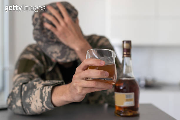 young attractive wasted and depressed addict and alcoholic man with ...