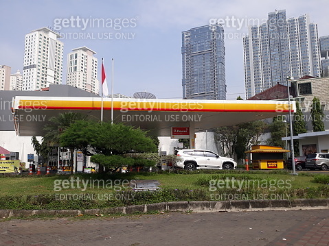a shell company motor vehicle refueling gas station place in the middle of Surabaya city with ...