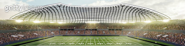 banner. Wide angle of crowded gririon stadium. American football ...