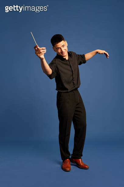 Portrait with one professional musician wearing elegant costume holding ...