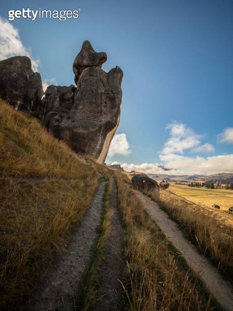 Animal shaped limestone boulder rocks nature landscape in dry grass ...