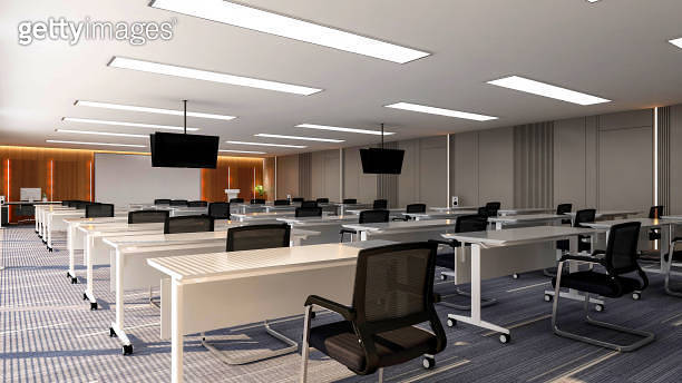 Interior of large modern office training room with large curved monitor ...
