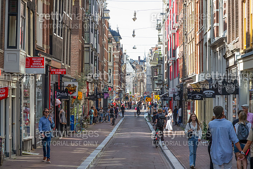 Cozy narrow shopping street with many small shops and boutiques in the ...