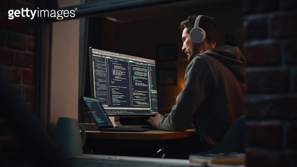 Professional Software Developer Writing Mock-up Code with Basic Programming Language. Program ...