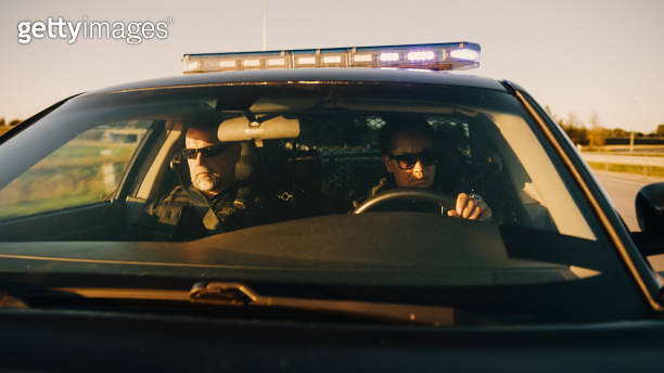 Point of View: Two Police Officers Driving Traffic Patrol Car, Ready to ...