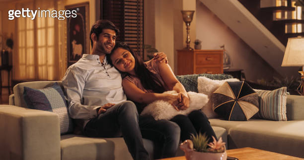 Movie Night: Young Couple Relaxing on the Couch, Watching Exciting ...