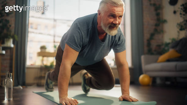 Strong Athletic Fit Middle Aged Man Doing Mountain Climber Exercises ...