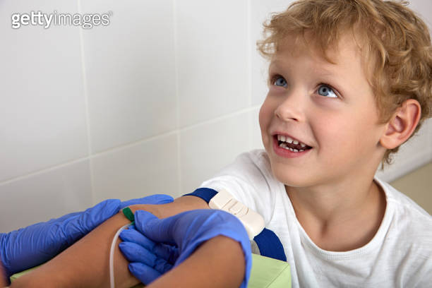 brave child takes tests in the clinic during the annual medical ...