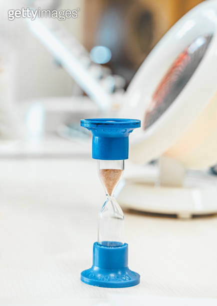 Hourglass in medical office undergoing advanced laser vision treatment ...