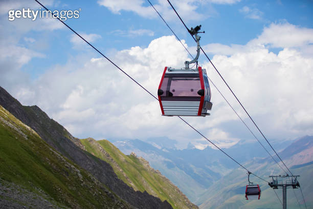 Cableway in the mountains. The landscape of the cable car of the ...