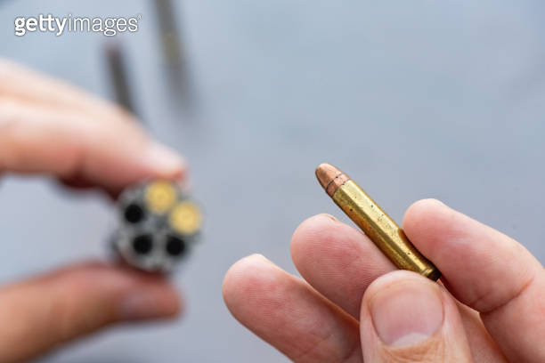 Close Up of Gun Barrel Being Loading with Bullets 이미지 (1702676130) - 게티 ...