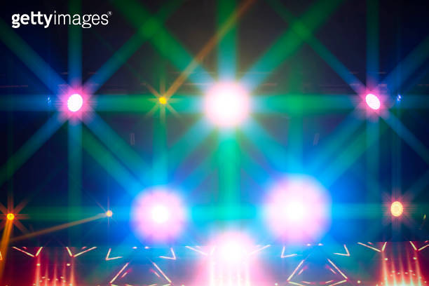 Bright multi-colored iridescent lights of stage lighting. Background ...