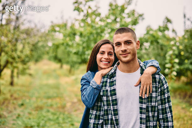 A portrait of two beautiful lovers, spending a day in nature, smiling ...
