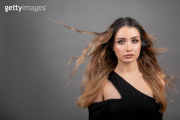 Beauty salon. Beautiful female model with flowing hair, with open ...