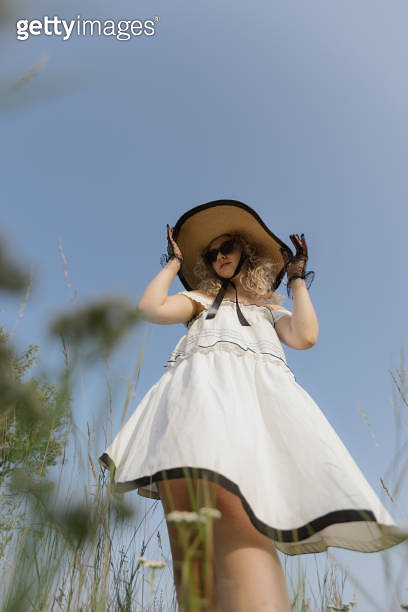 View bottom.Glamorous image of romantic woman in snow-white summer ...