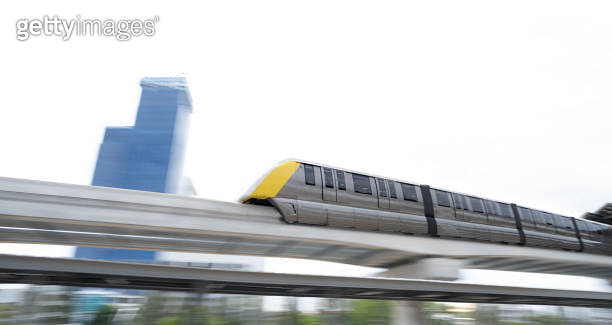 Elevated monorail train fast move on rail. Public transit monorail ...