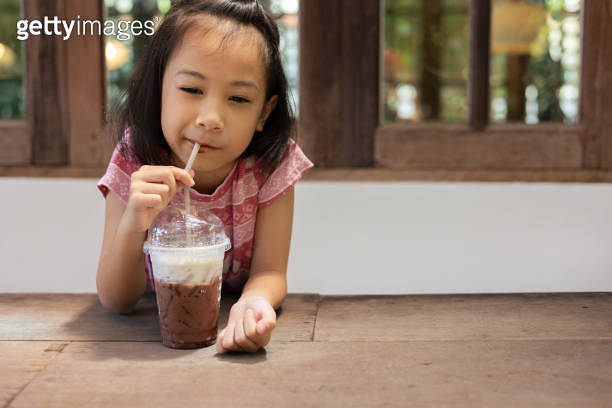 Cheerful and positive living, where people, asian adorable kid sips of ...