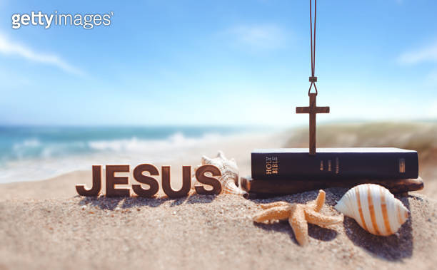 Bible book and cross church on summer sea and wavy sand beach Summer ...