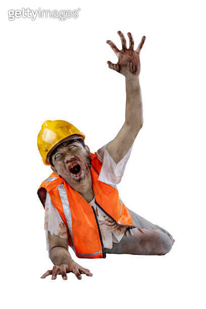 A scary construction worker zombie with blood and wounds on his body ...