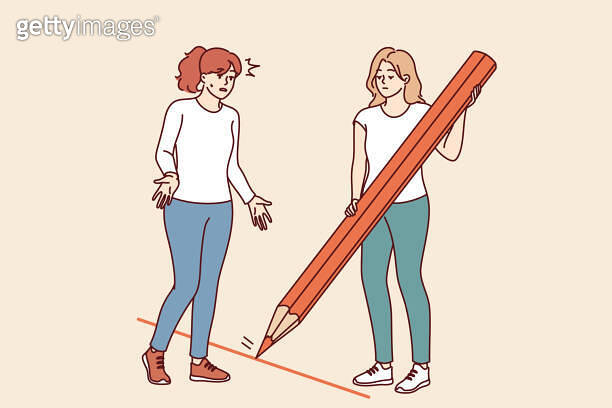 Woman draws boundary and prohibits crossing it, using large pencil to ...