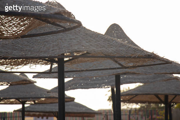 wicker umbrella on a hotel beach in egypt on a sunny day (1496836703 ...