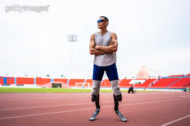 Asian para-athletes disabled with prosthetic blades standing at stadium ...