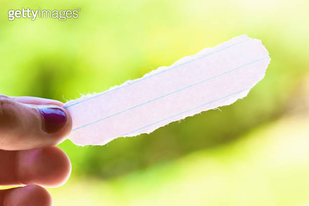 Blank slip of paper being held by a teenage girl, with copy space ...