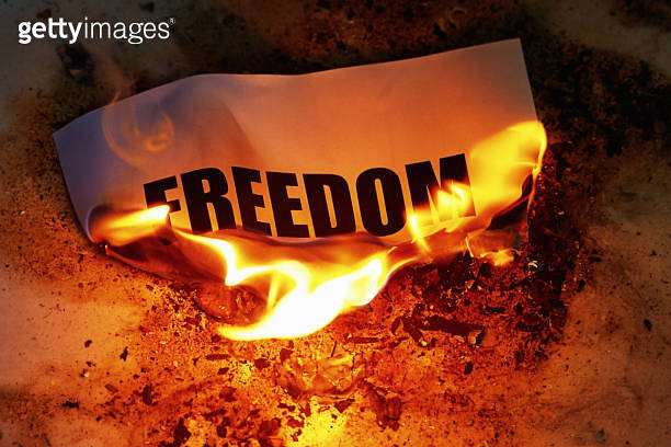 Freedom is destroyed: the word goes up in flames 이미지 (1473019651) - 게티이미지뱅크