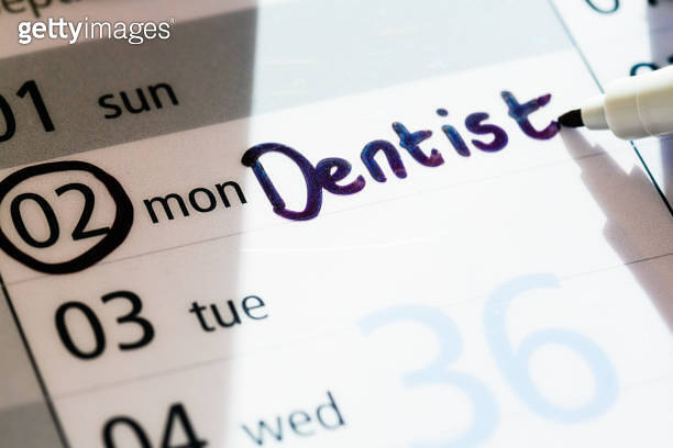 Dentist appointment handwritten on a year planner calendar (1765155338 ...