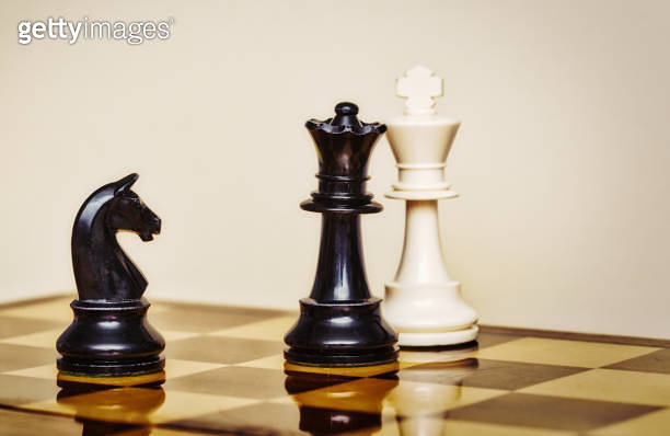 Checkmate! White queen defeats black king in a game of chess ...