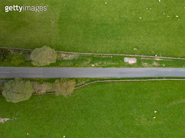 Looking straight down on a country road in a rural area of Cumbria, UK ...