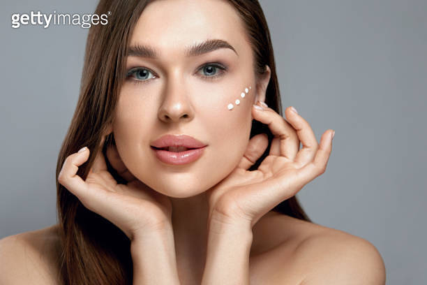 Happy beautiful girl holding her cheeks with a laugh looking to the ...