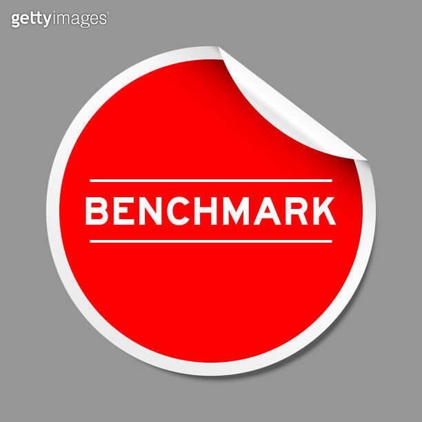 Red color peel sticker label with word benchmark on gray background ...