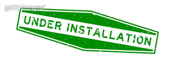 Grunge green under installation word hexagon rubber seal stamp on white ...