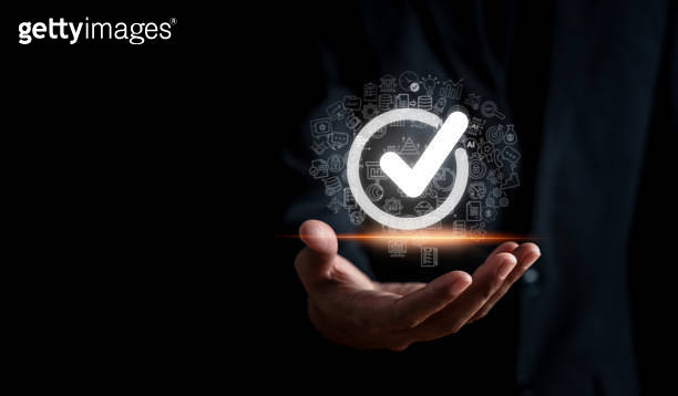 Hand man holding tick or check mark correct sign for quality standards ...