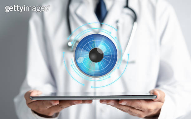 Digital vision eye care concept. Doctor using technology for eye test ...