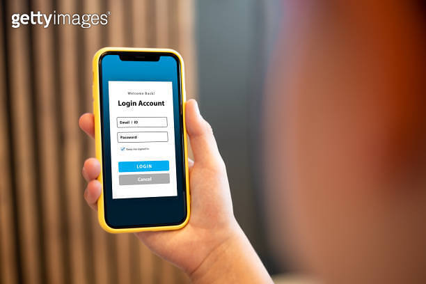 Teenage boy holding phone and login to account. (1715439383) - 게티이미지뱅크