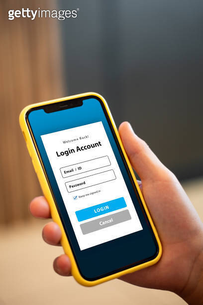 Teenage boy holding phone and login to account. (1715439384) - 게티이미지뱅크