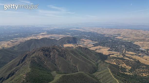 an aerial view of a landscape in the distance with hills and houses 이미지 ...