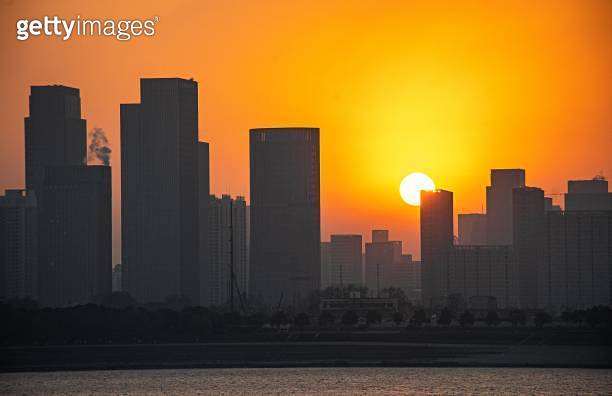 Stunning aerial view of a bustling metropolitan cityscape bathed in the ...