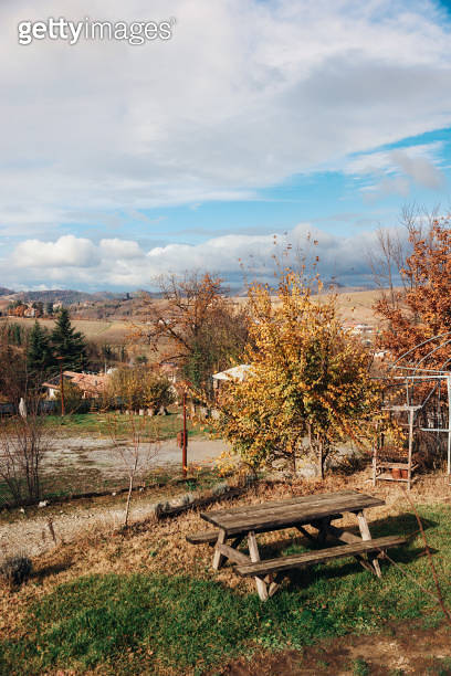 Picnic table in front of beautiful Langhe landscape in Autumn ...